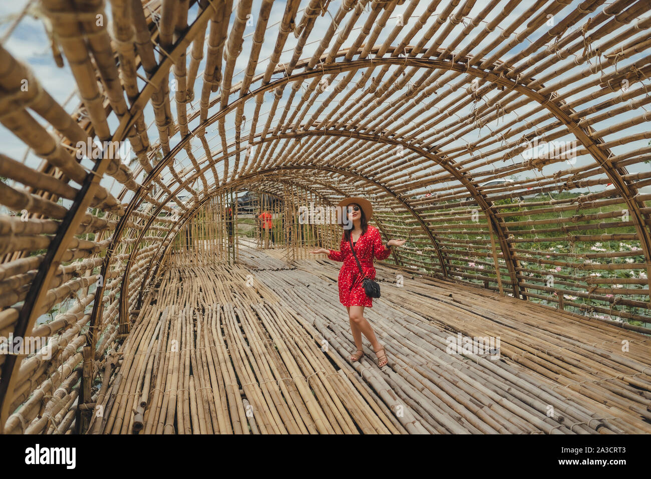 Red girl at the giant fish trap at Suphanburi, Thailand Stock Photo - Alamy