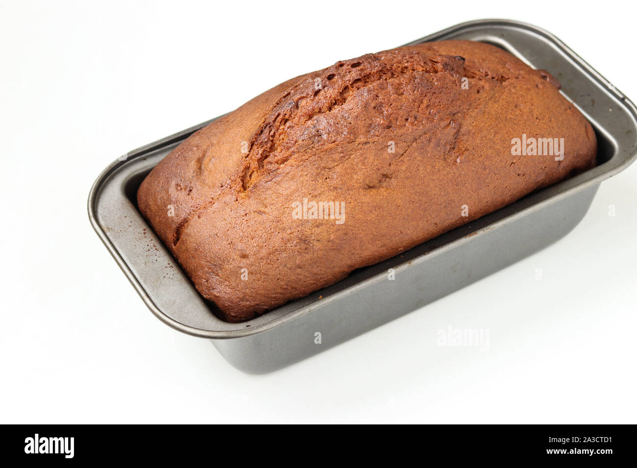Cupcake in a rectangular metallic shape isolated on white background ...