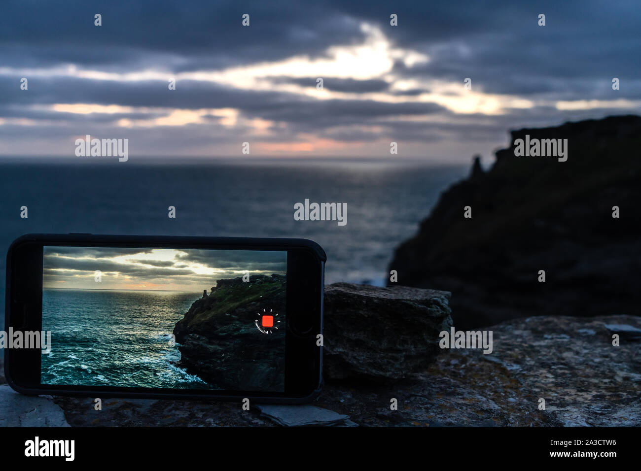 Smart phone capturing sunset time-lapse Stock Photo - Alamy