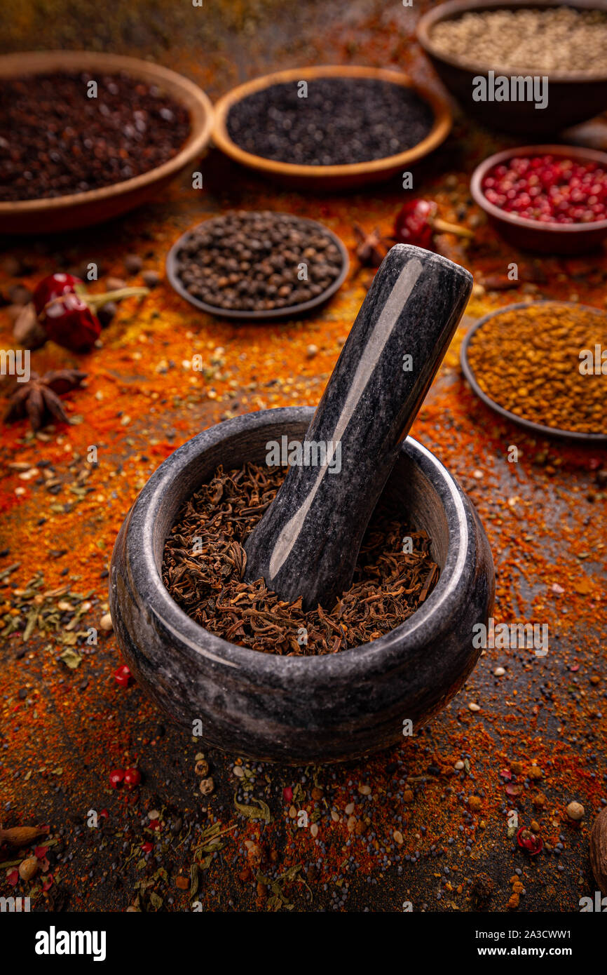 Spice in mortar, Spice and herbs composition Stock Photo - Alamy