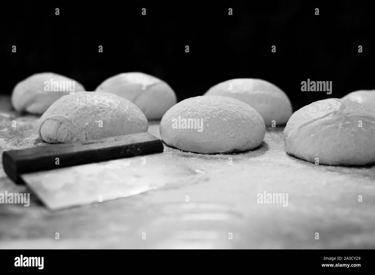 Ball of pizza dough on table with dusting of flour Stock Photo - Alamy