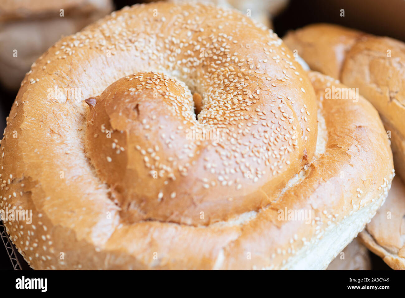 Breads and baked goods close-up. Fresh challah bread for shabbat. Bakery bread roll, bun ...