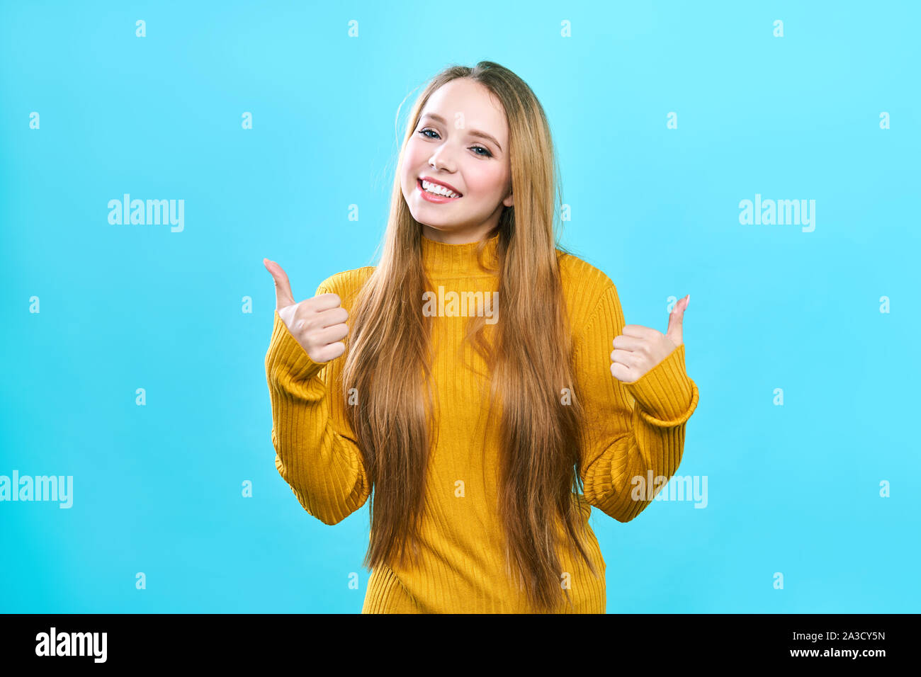 Happy excited woman smile holding thumbs up gesture, beautiful young ...