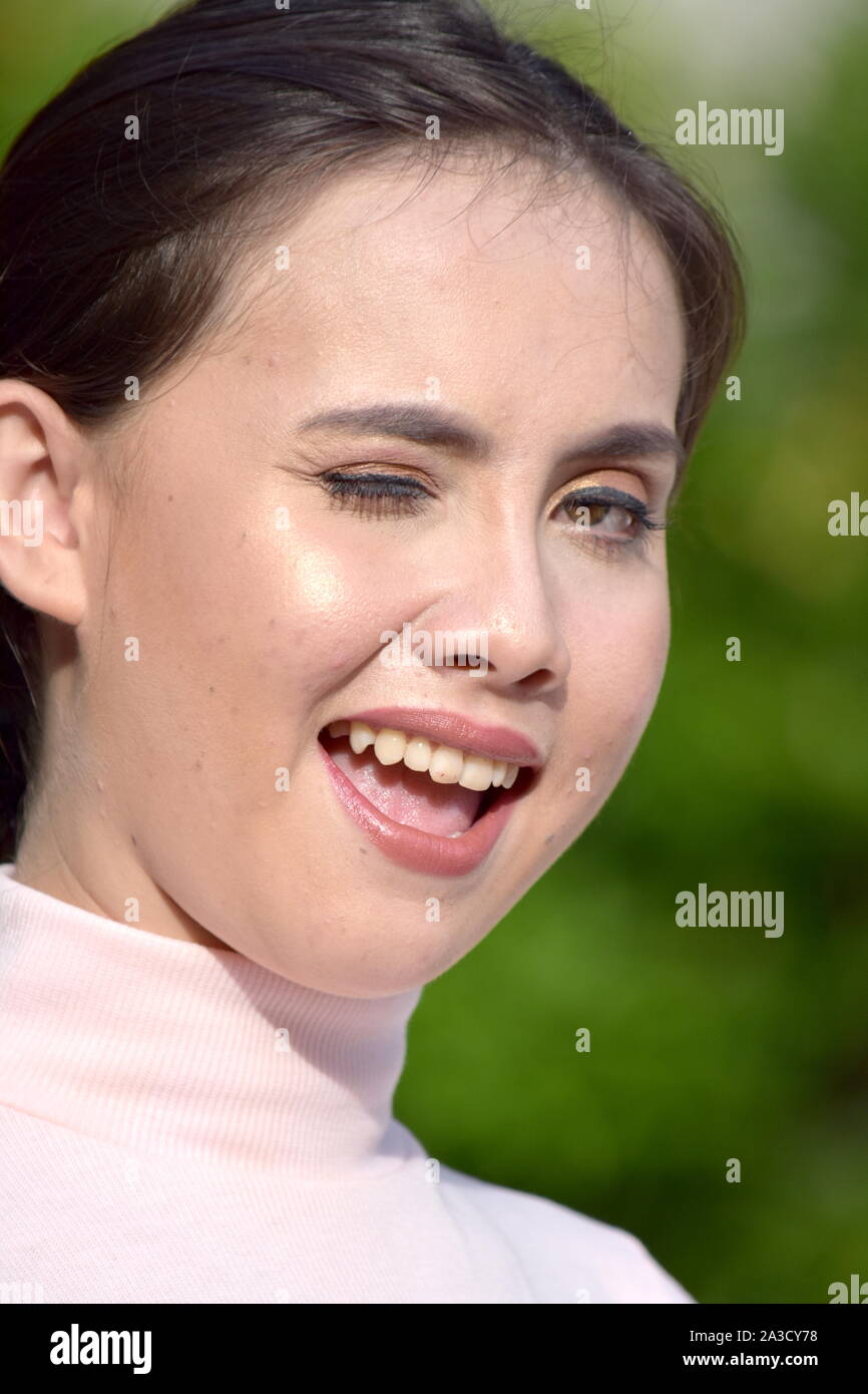 An An Attractive Female Winking Stock Photo - Alamy