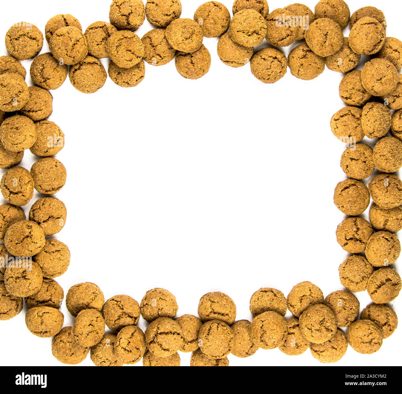 Frame of pepernoten from above on white background for annual ...