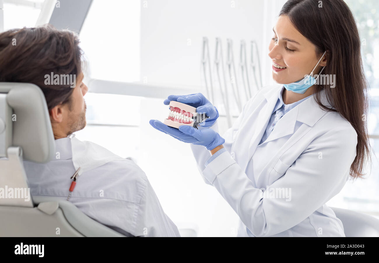 Dentist explaining human teeth structure hi-res stock photography and ...