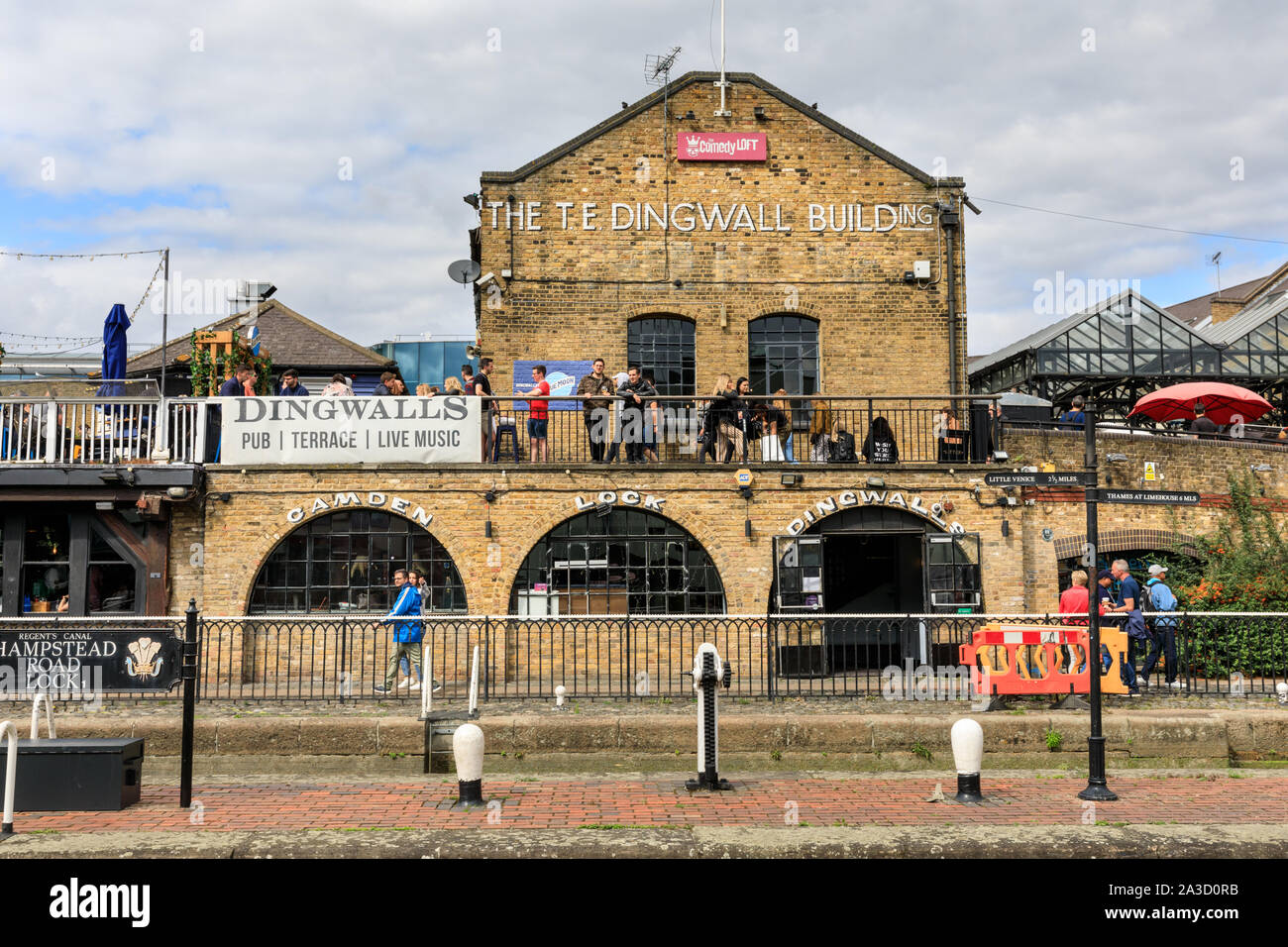People eating and drinking at Camden Lock Market, canal and Dingwalls ...