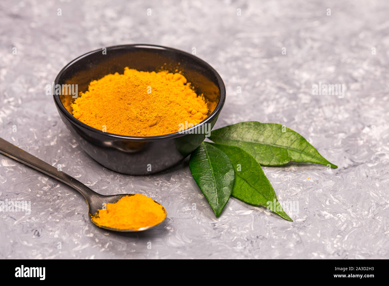 Turmeric powder close up on a grunge cooking table Stock Photo - Alamy