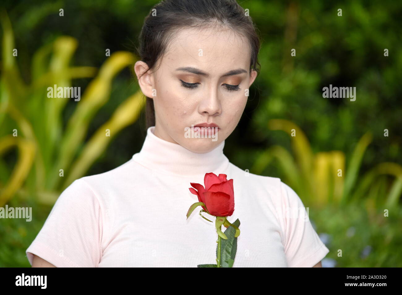 Sad girl flower hi-res stock photography and images - Alamy