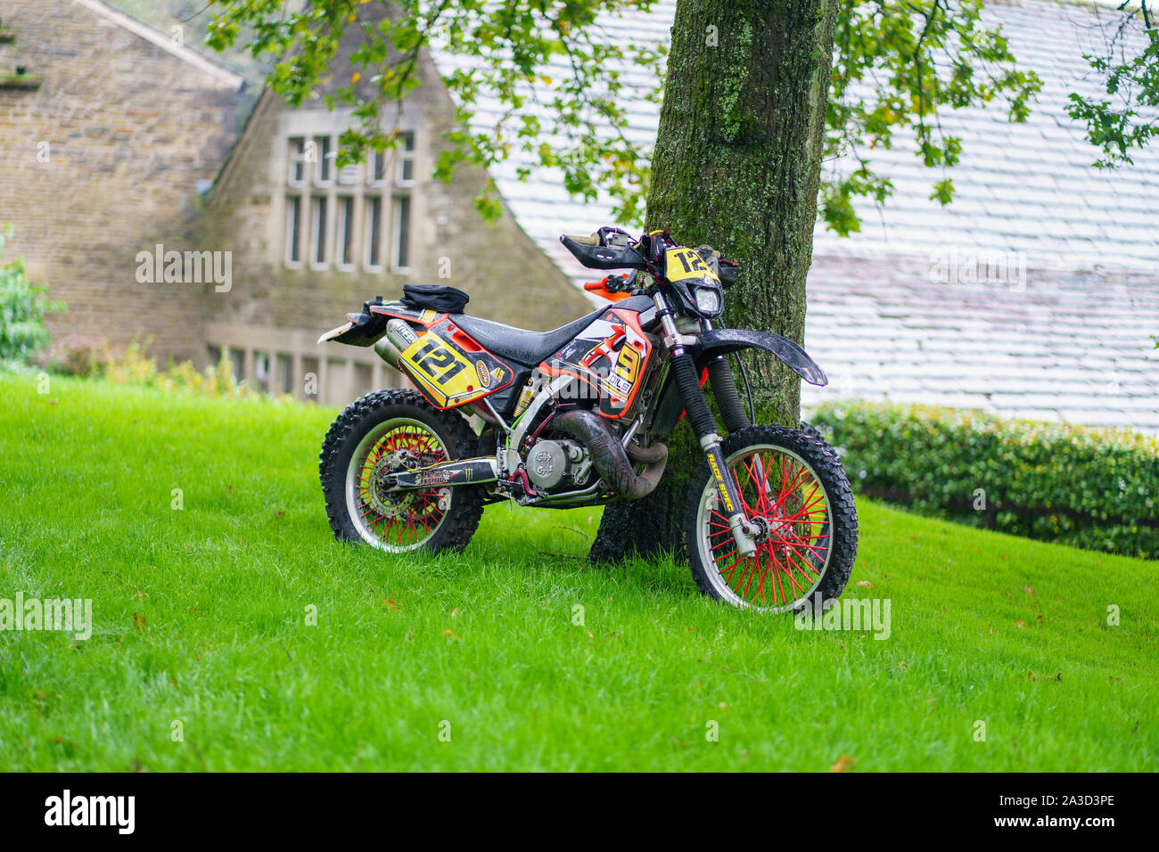 Motocross dirt bike on grass backdrop Stock Photo - Alamy