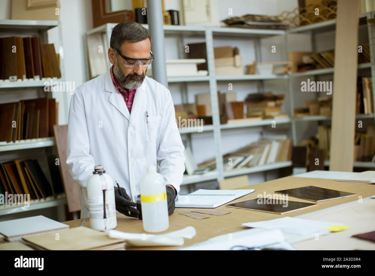 Senior male researcher in a color lab Stock Photo - Alamy