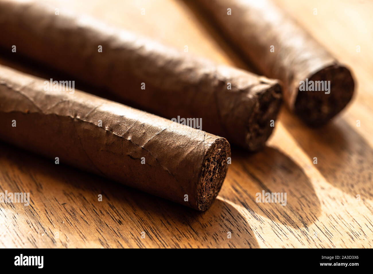Three cigars ends Stock Photo - Alamy