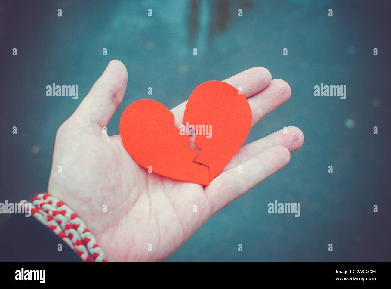 Divorce concept - Broken heart in the male hands Stock Photo - Alamy