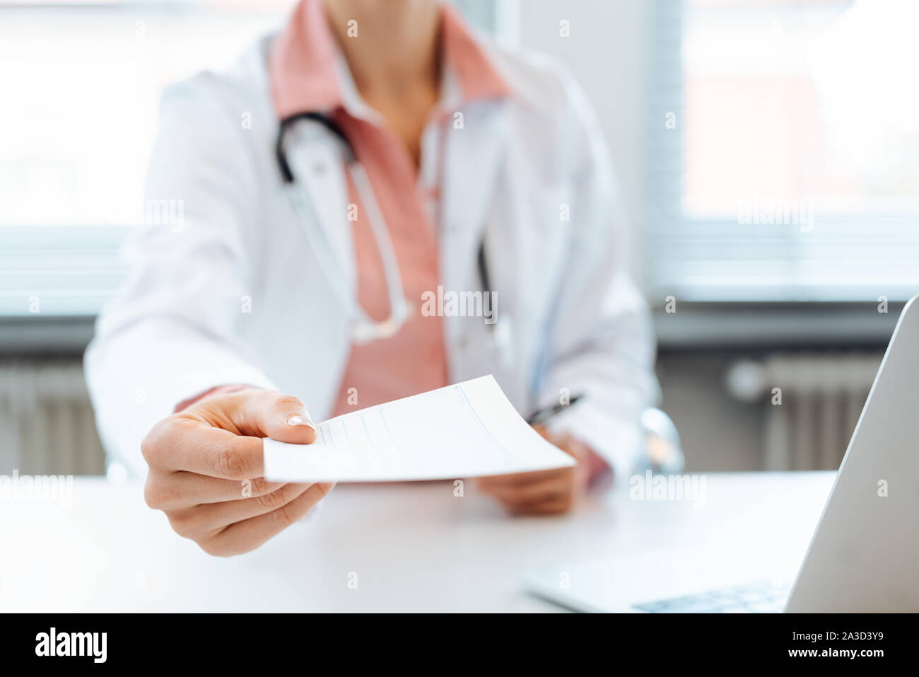Doctor giving paper hi-res stock photography and images - Alamy