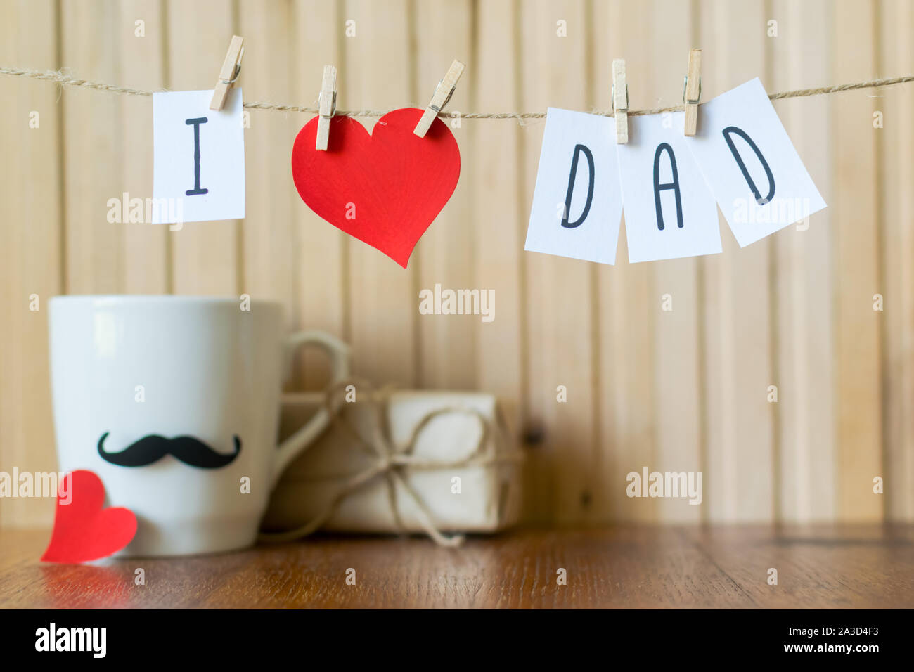 Fathers day greeting. Message with paper heart hanging with clothespins ...