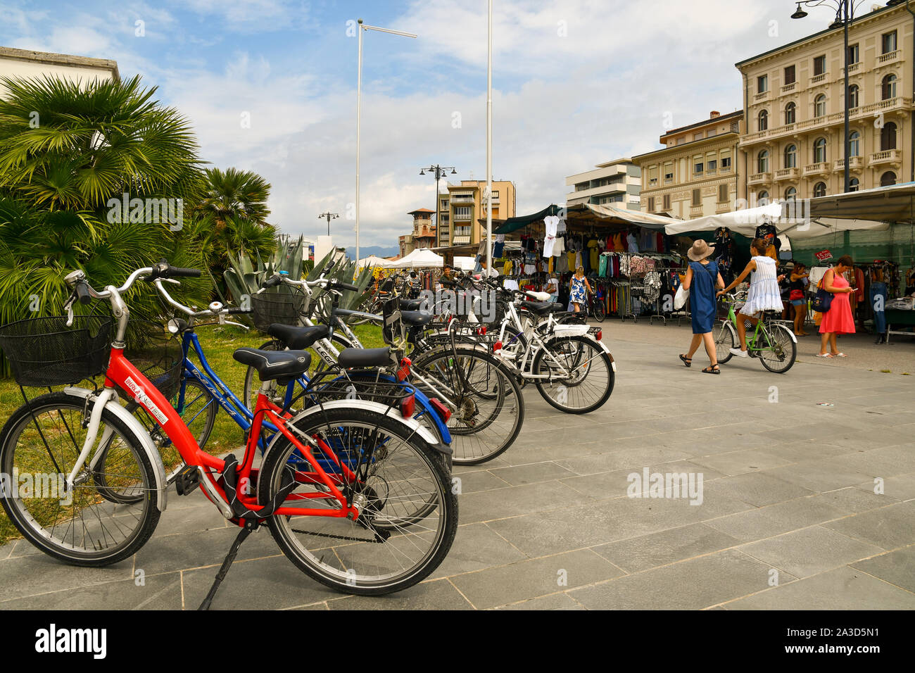 View of the promenade of Viareggio with parked bicycles and stands of ...