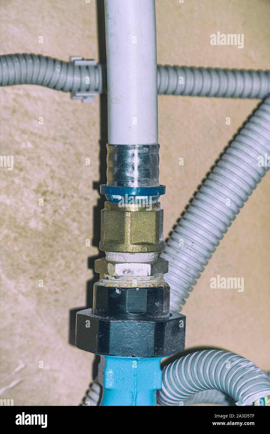 Connection of plastic pipes through the coupling. Plumbing water supply ...