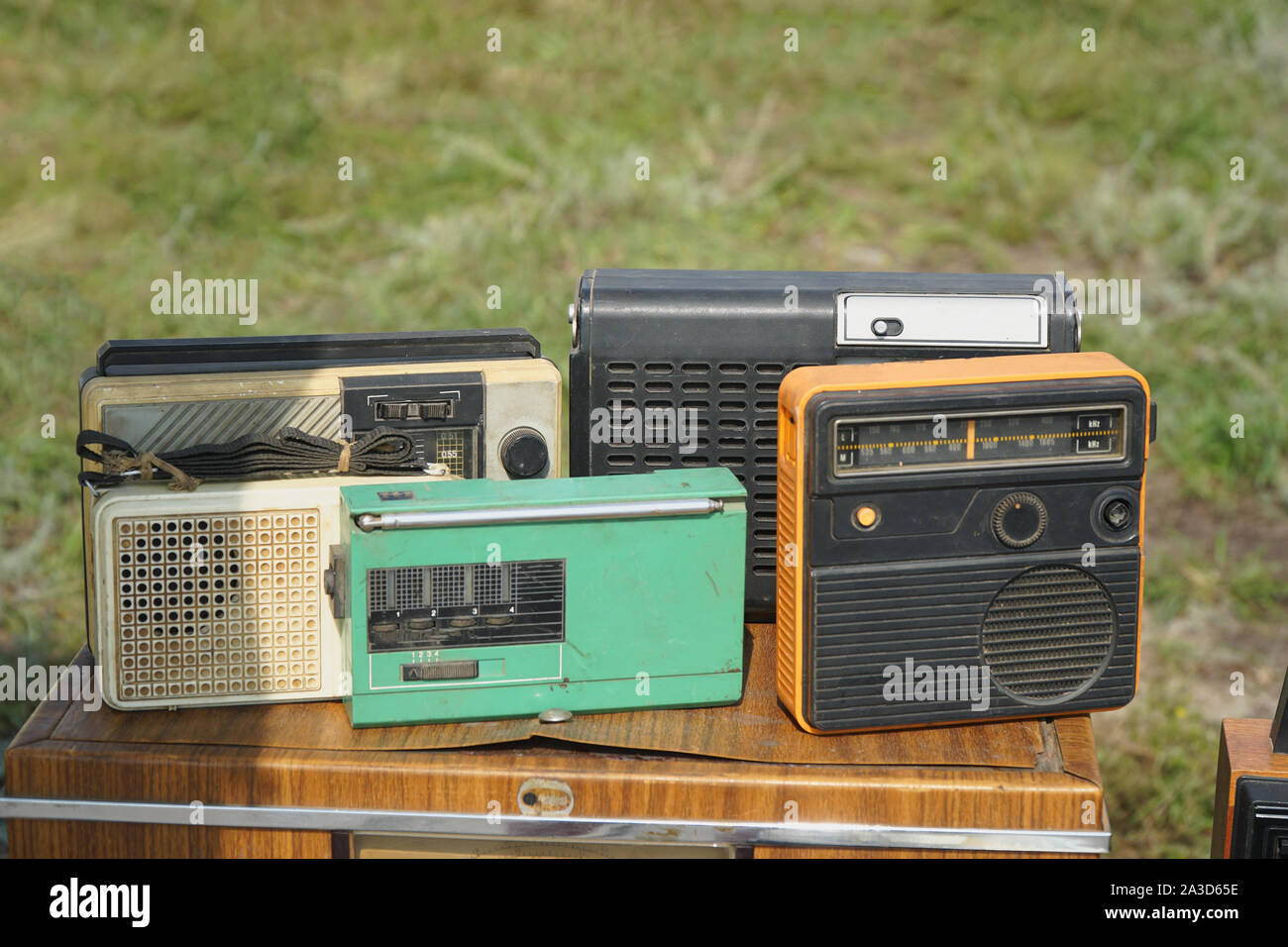 Old transistor radios on the table. Old compact transistor receiver ...