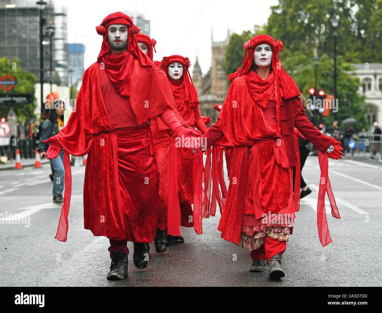 Protesters, dubbed the Red Rebels, outside the Cabinet Office on ...