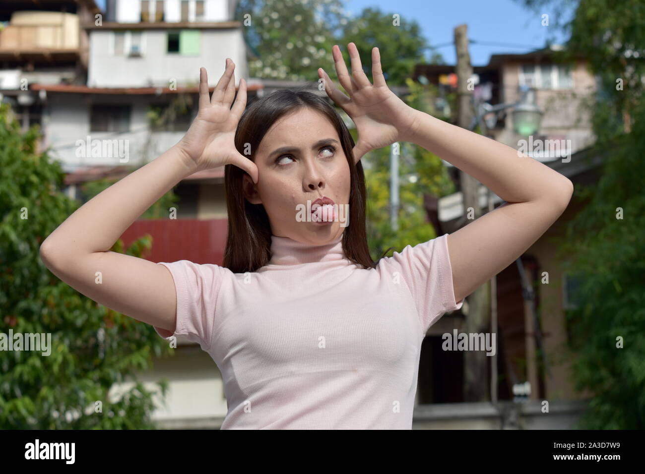 Young attractive woman making funny hi-res stock photography and images ...