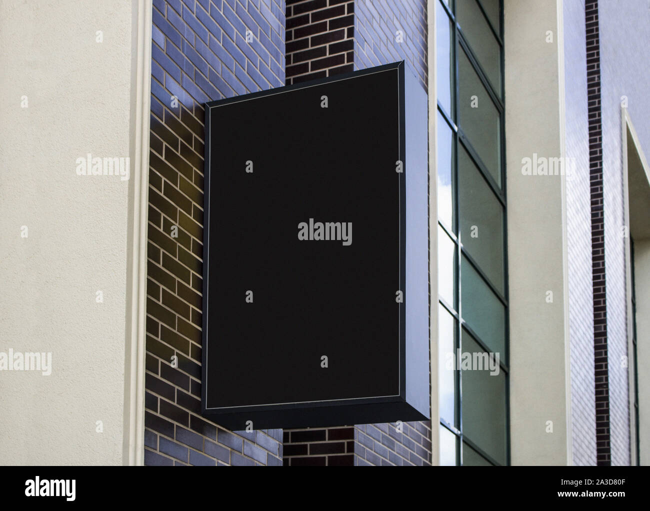 Blank black outdoor box mock up on brick wall mounted Stock Photo - Alamy