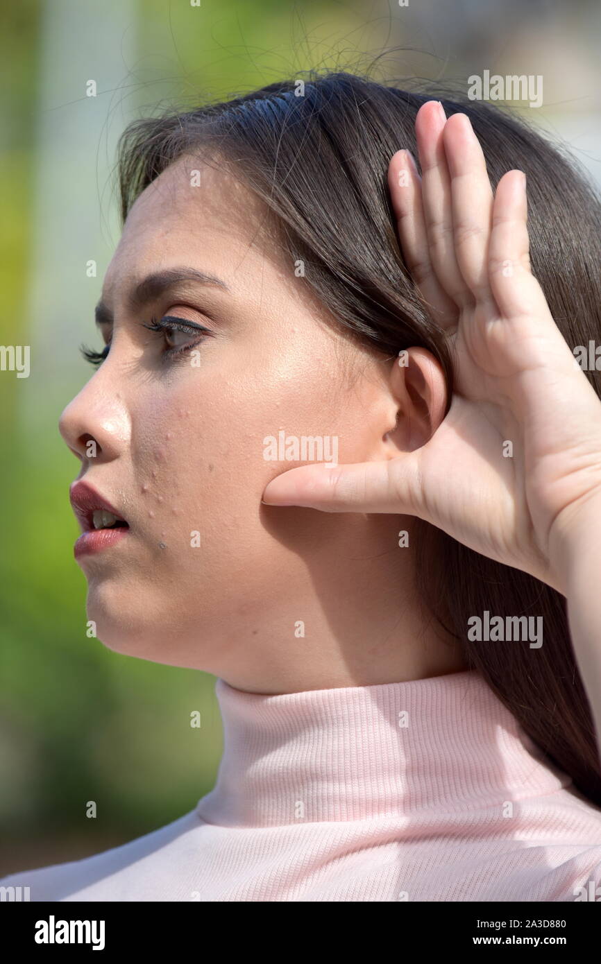 Young asian woman listening hi-res stock photography and images - Alamy