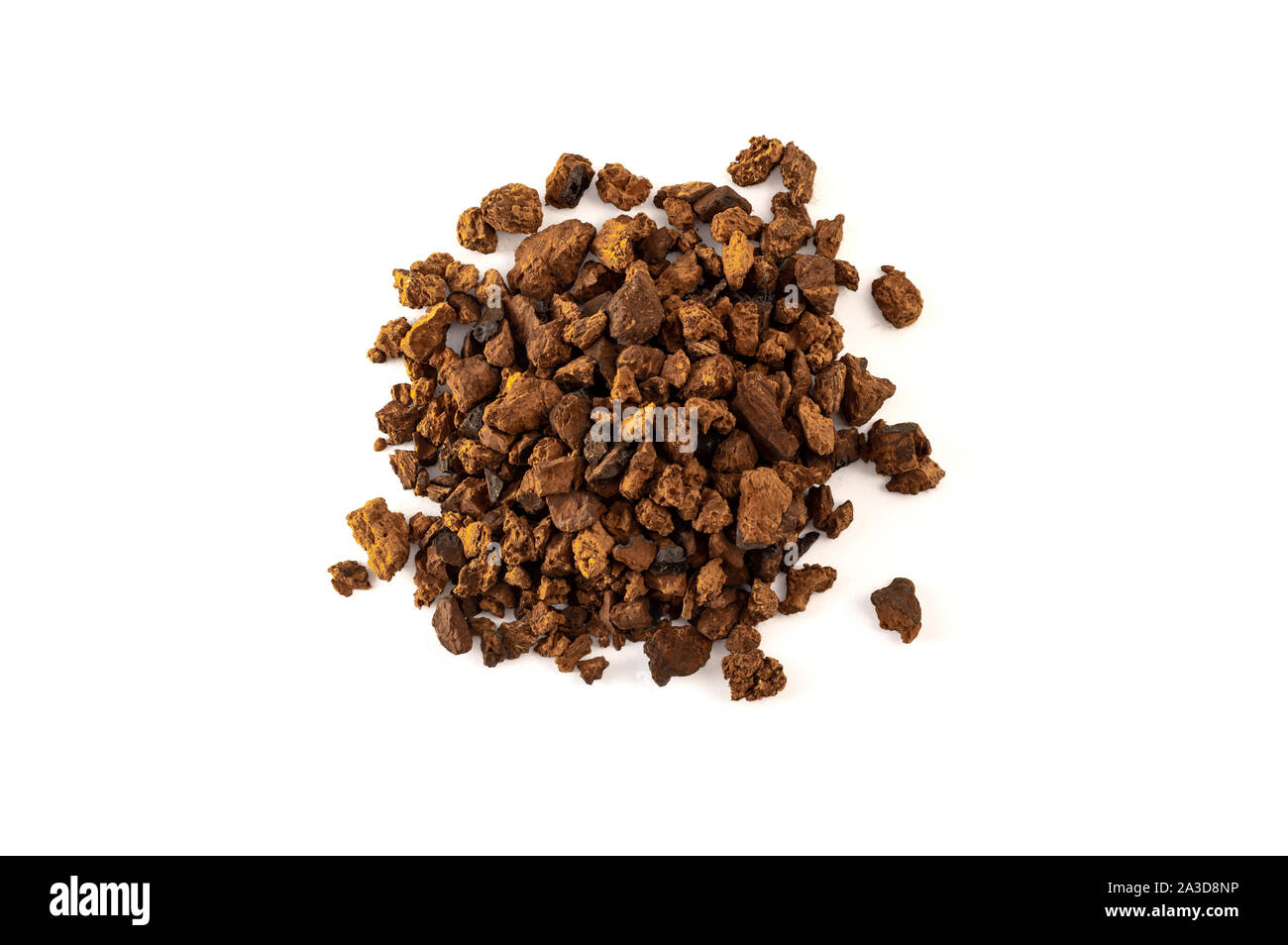 a pile of natural and wild chaga mushroom pieces on white background ...