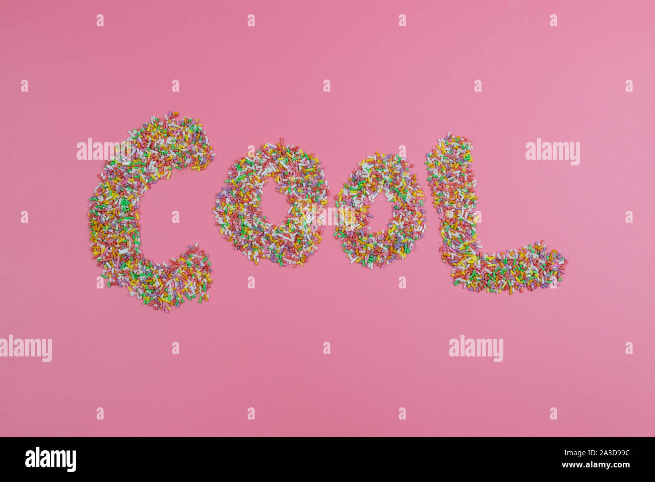 Word Cool written with colorful candy on a pink background Stock Photo ...