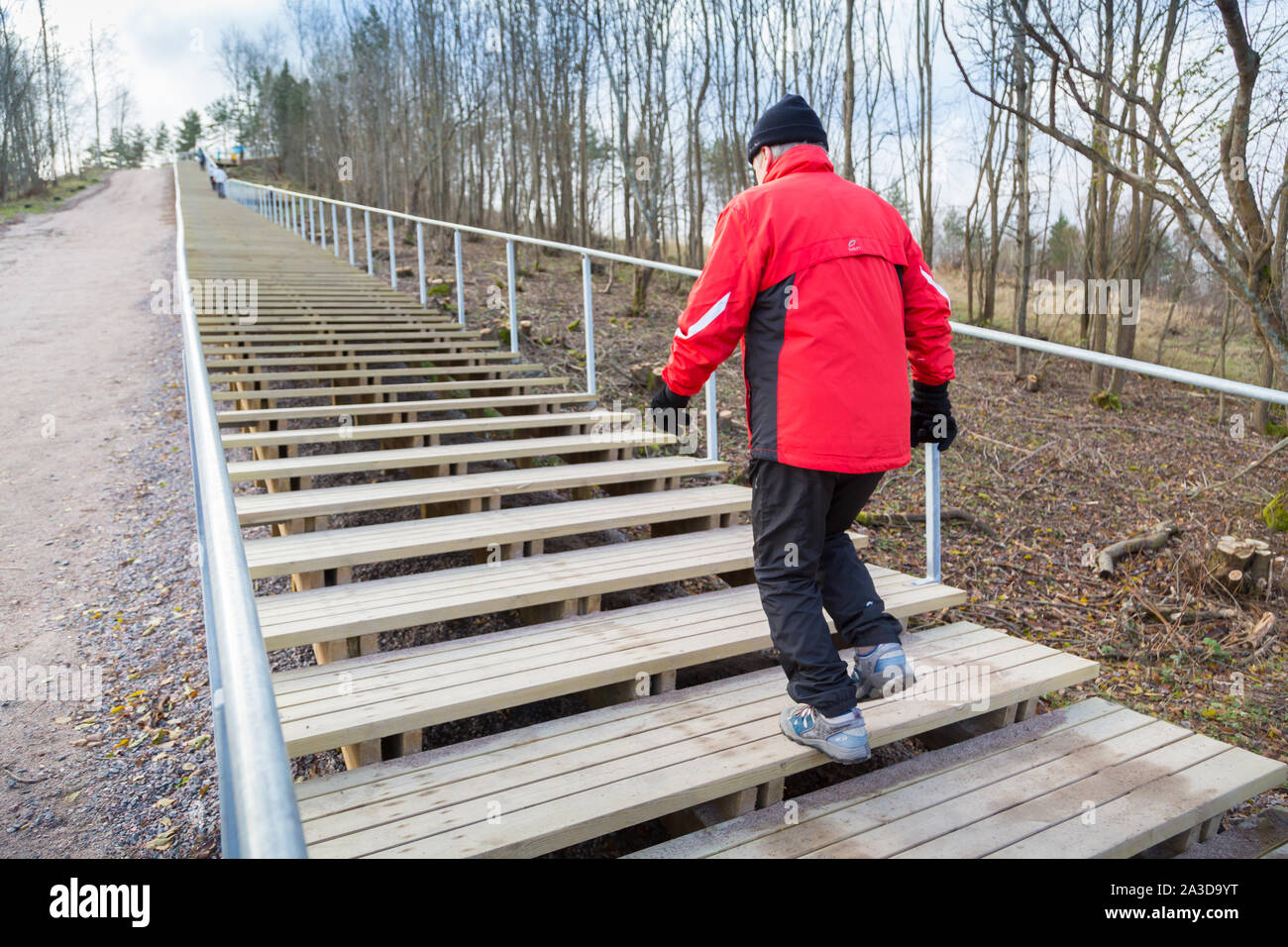 Elderly man making daily excercise by walking stairs Stock Photo - Alamy