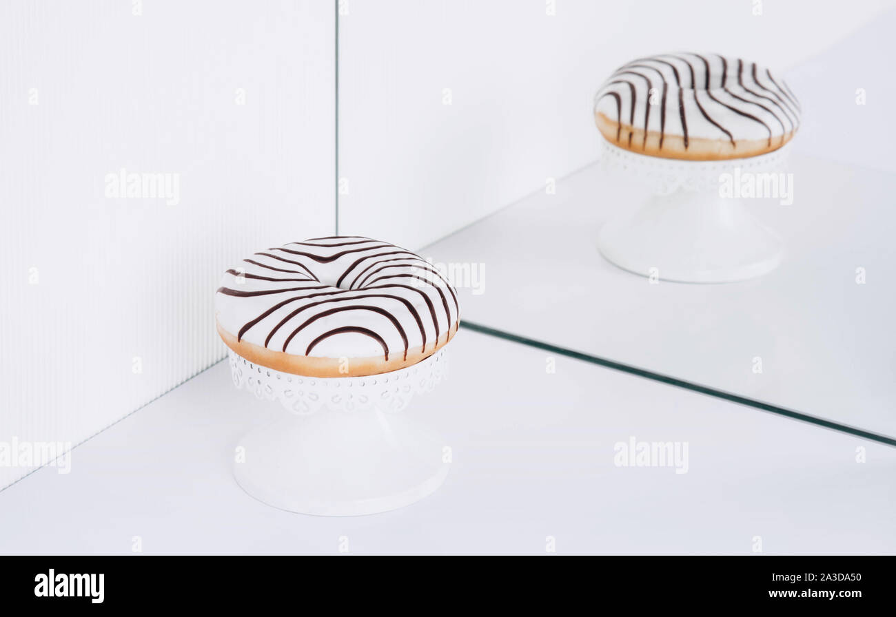 Striped donuts on a white background Stock Photo - Alamy