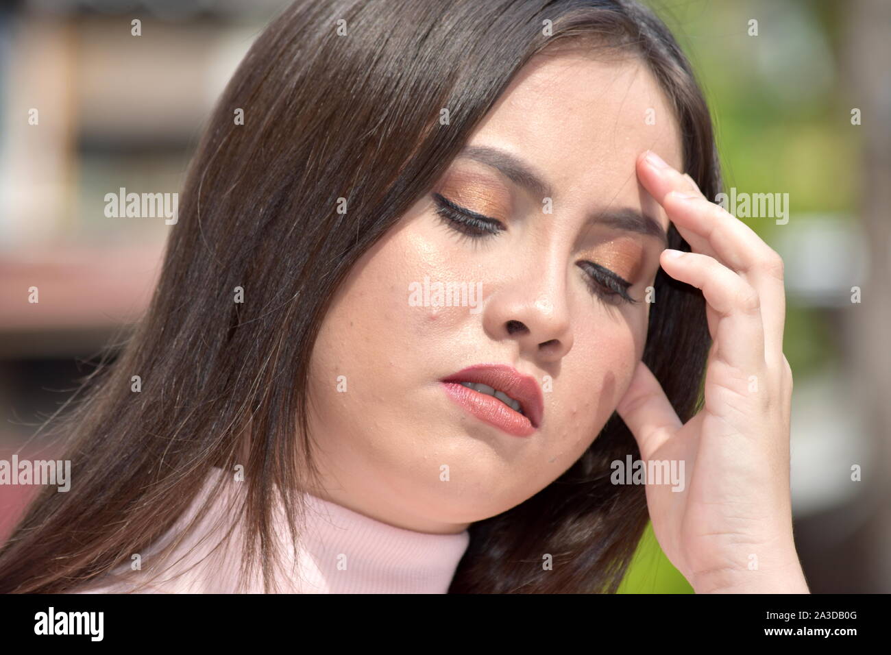 A Worrisome Attractive Asian Female Stock Photo - Alamy
