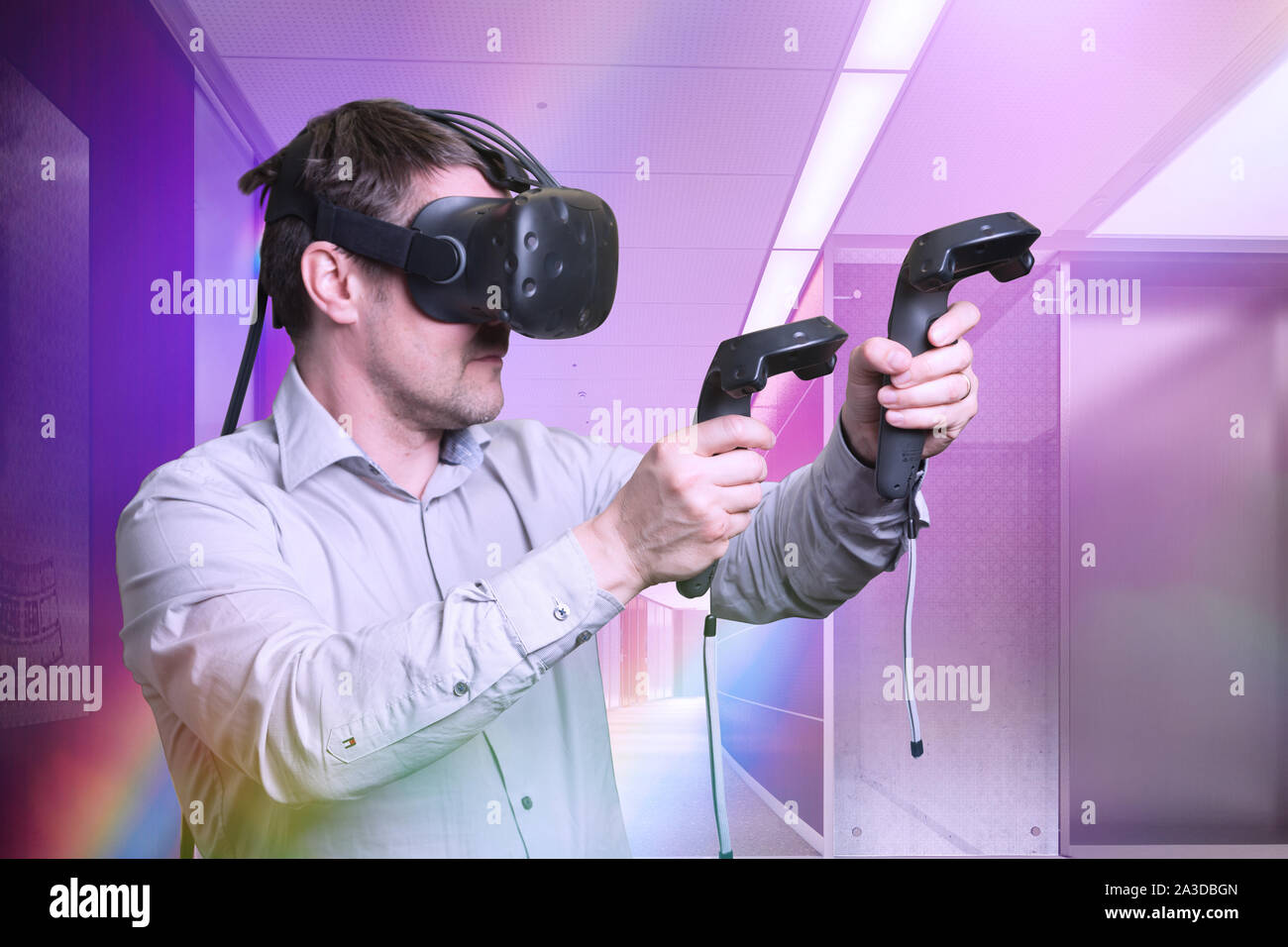 Handsome man wearing vr headset hi-res stock photography and images - Alamy