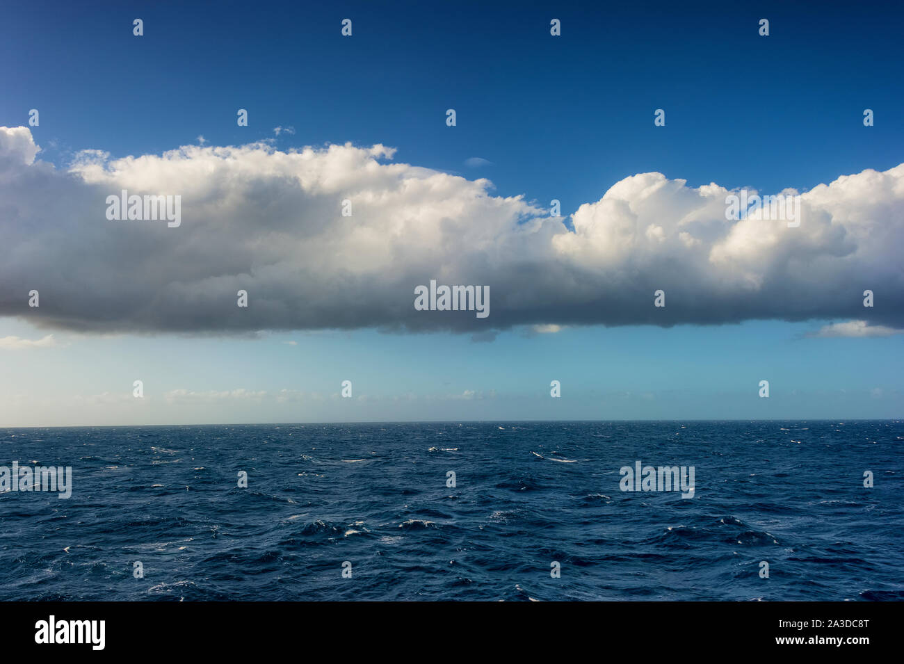 Background image of Atlantic ocean with cloud formations in the sky ...