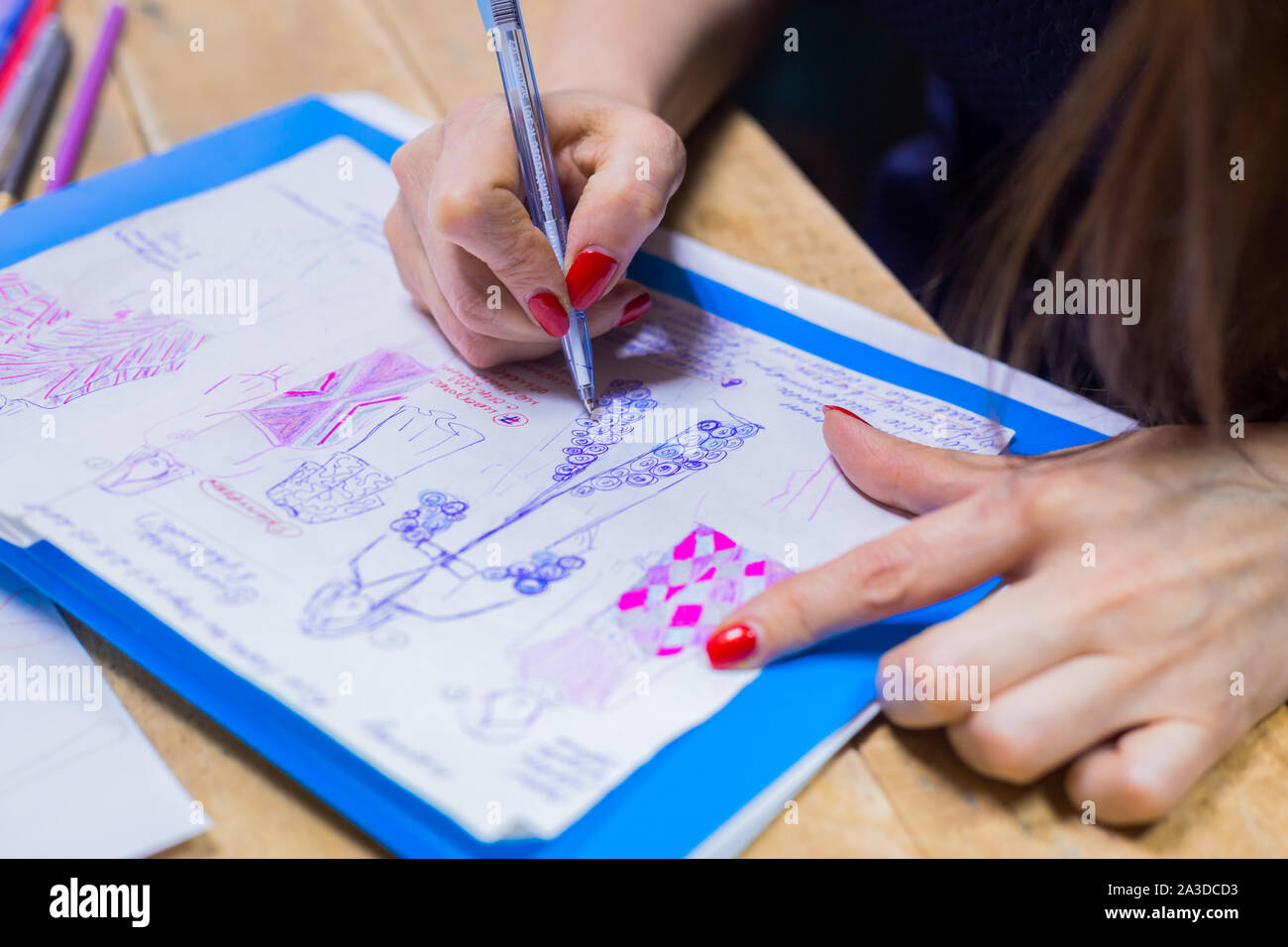 Fashion designer drawing design sketch Stock Photo - Alamy