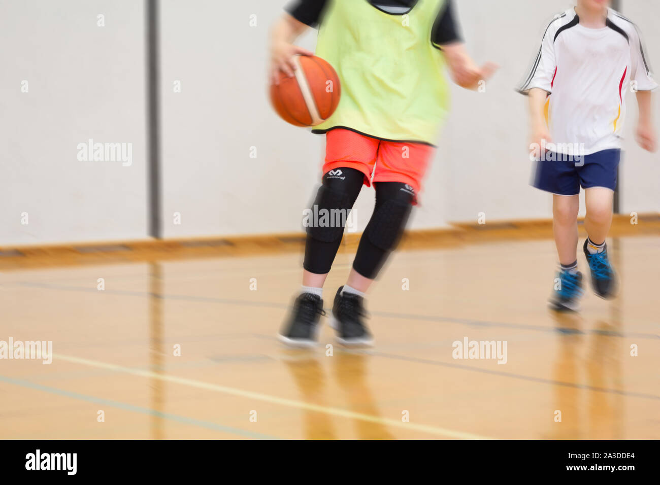 Group of disabled down syndrome men and women doing sports at indoor ...