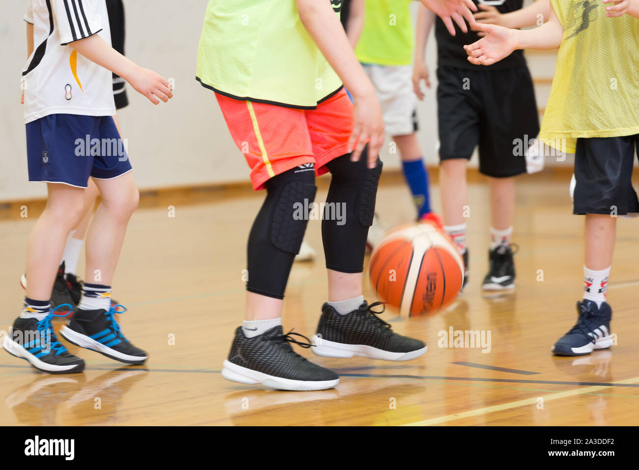 Group of disabled down syndrome men and women doing sports at indoor ...
