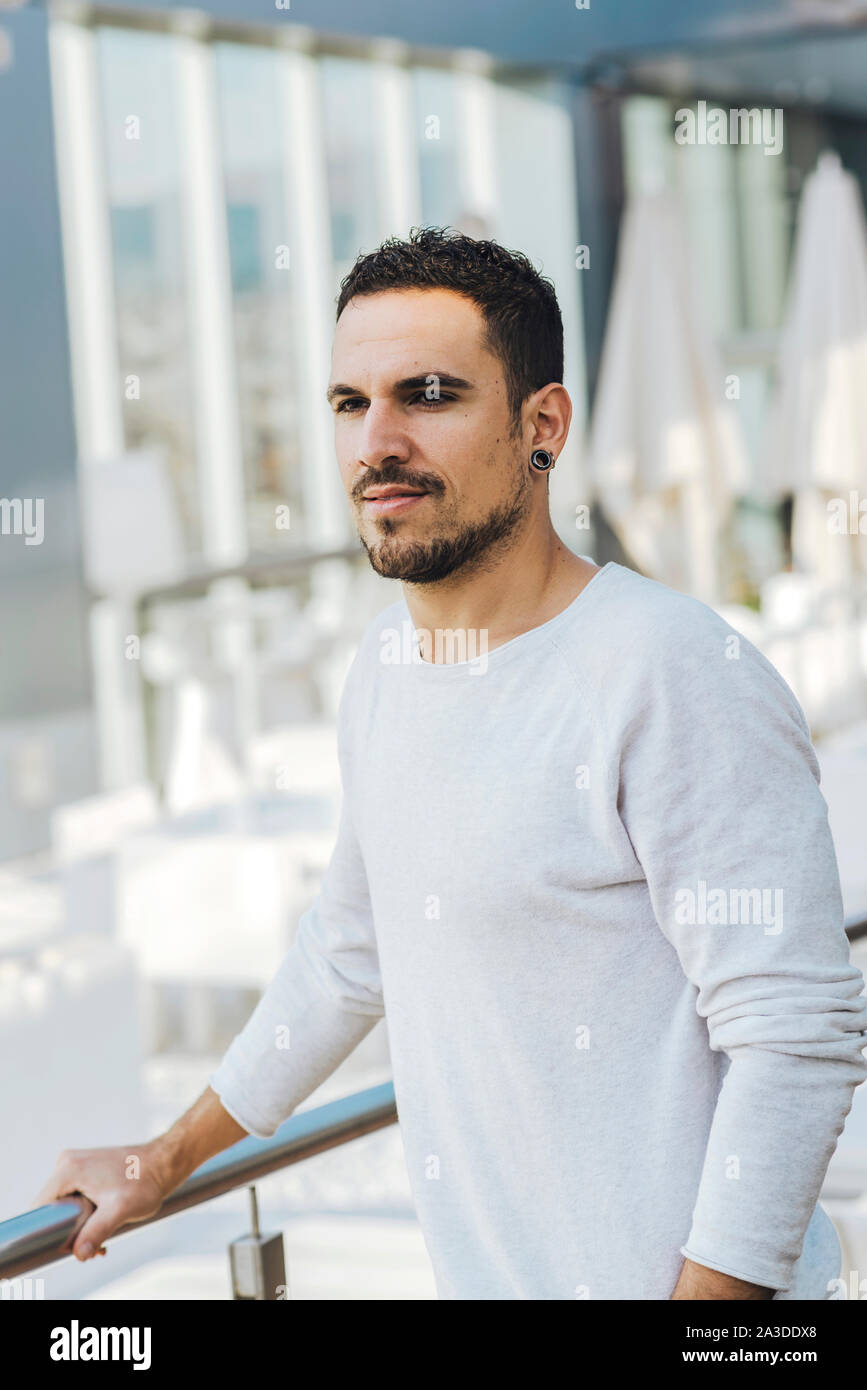 Man leaning on railing taking hi-res stock photography and images - Alamy