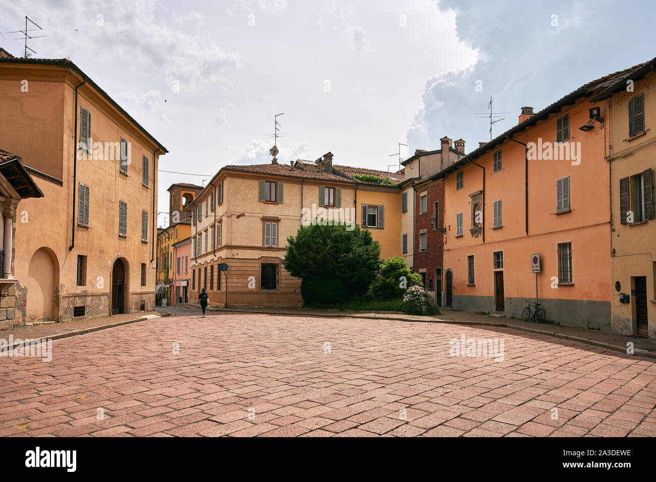 Paved square and facades of old buildings in daylight in ancient town ...