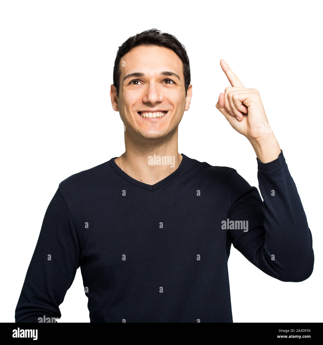 Young man raising his finger up isolated on white, solution or idea ...