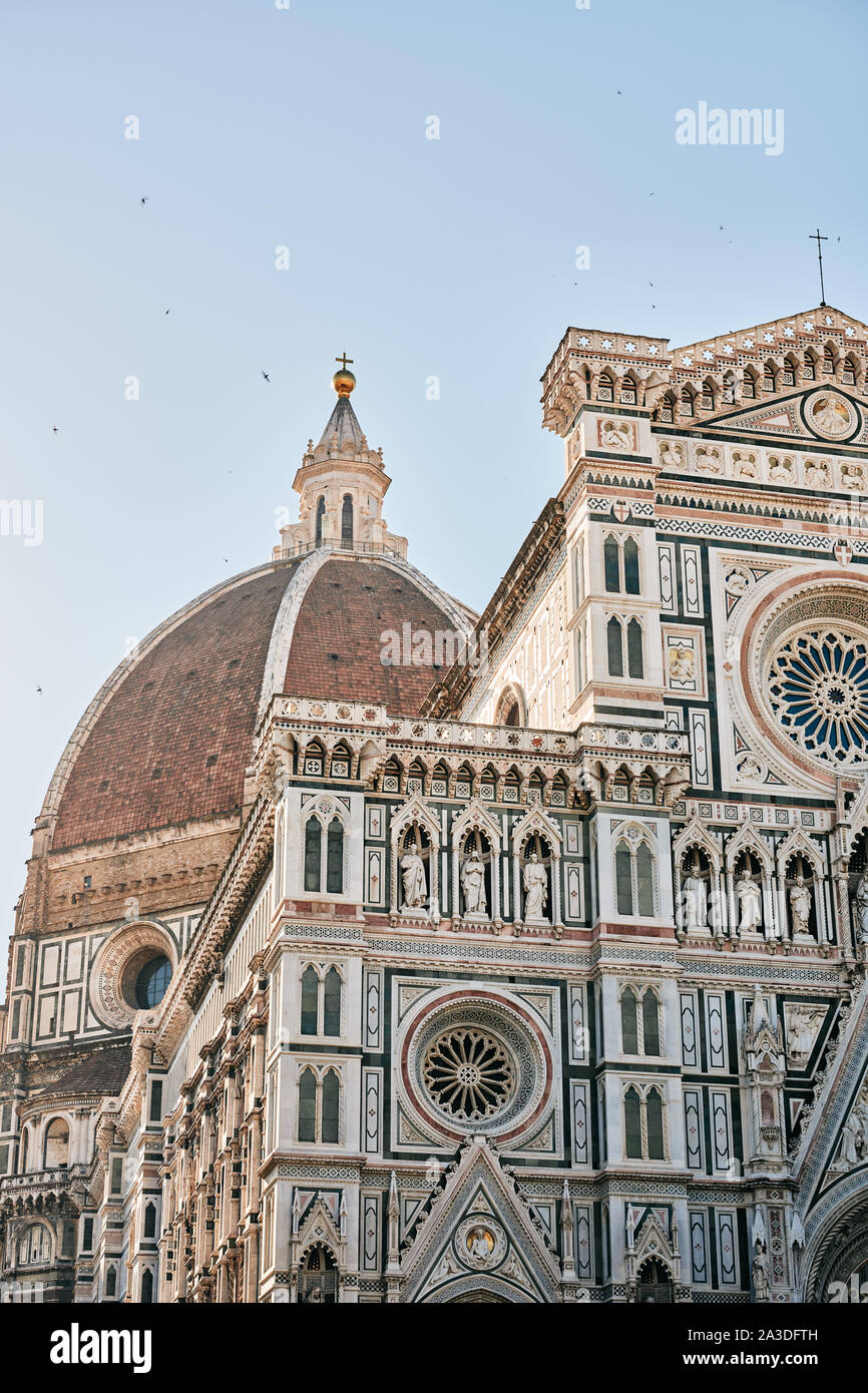 Magnificent Italian church with decorative elements and dome with cross ...
