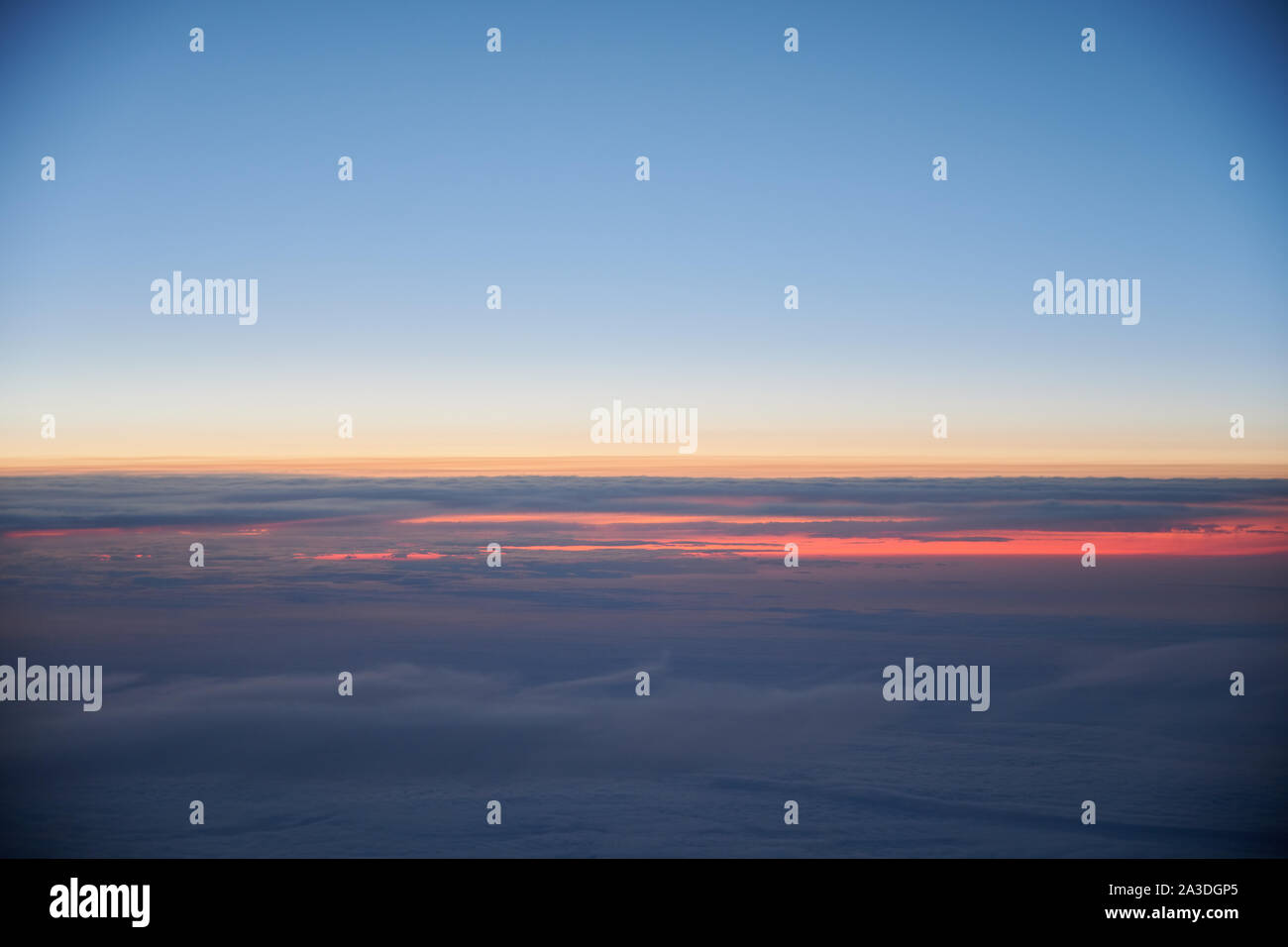 Airplane view from plane window to endless blue sky with clouds and ...
