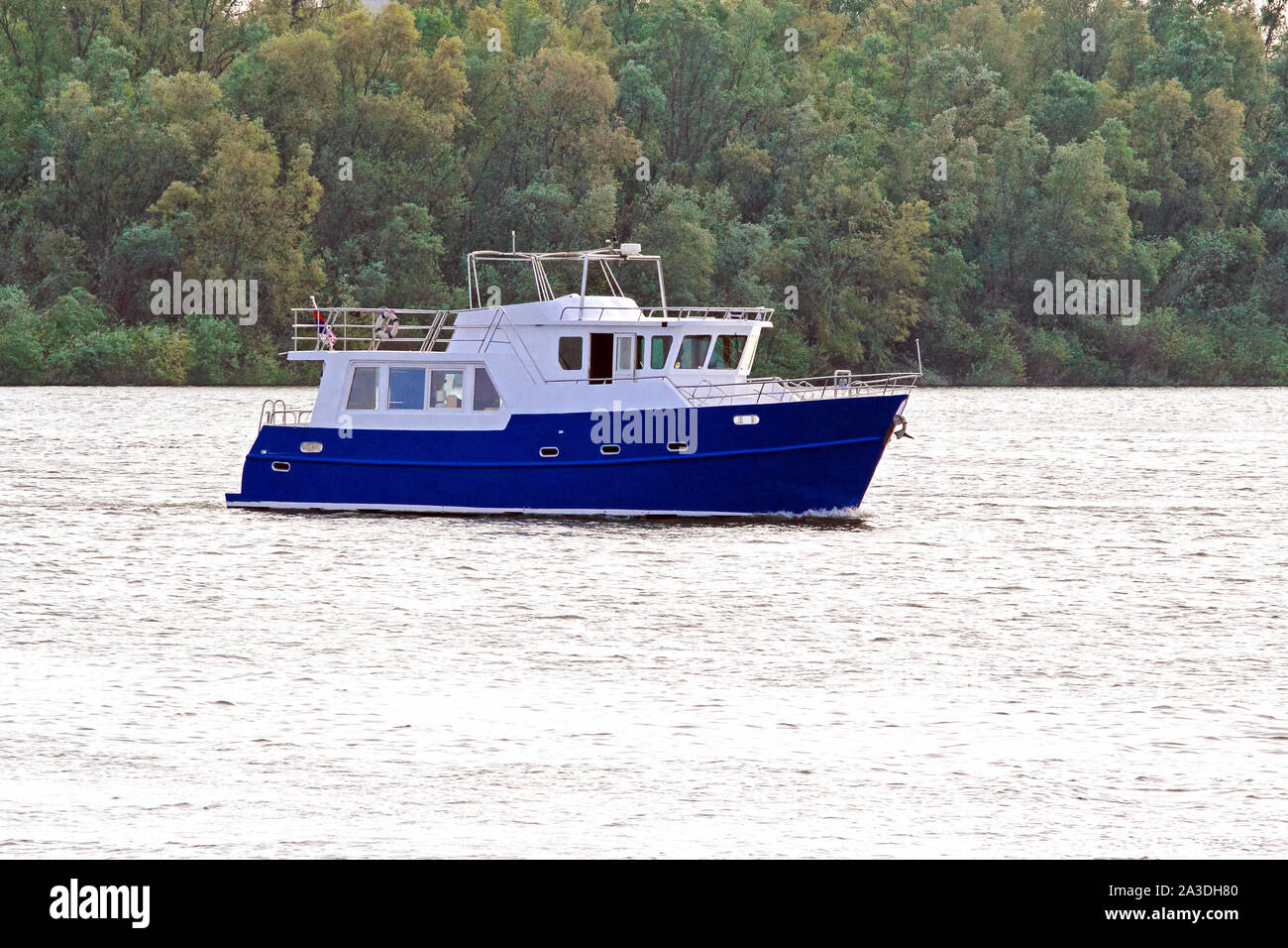 Blue motor boat float at big river Stock Photo - Alamy