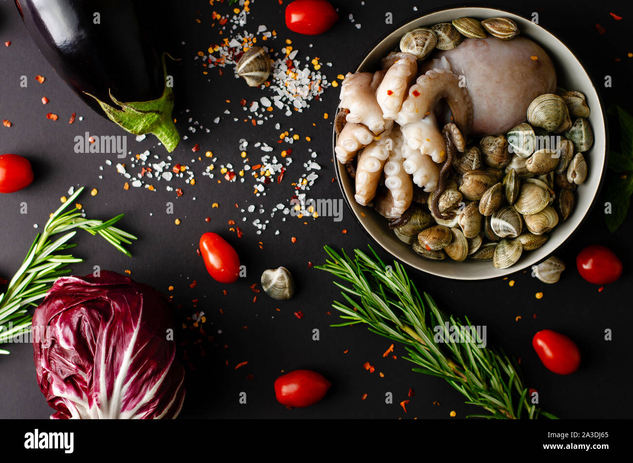 Raw fresh Clams with octopus, tomatoes cherry, eggplant, red cabbage ...