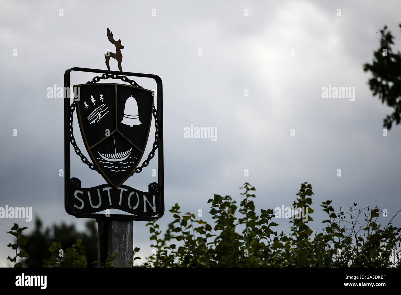 A traditional village sign for the small countryside village of Sutton ...