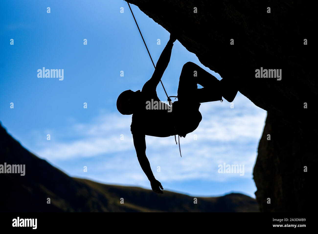 Rock climbing silhouette hanging hi-res stock photography and images ...