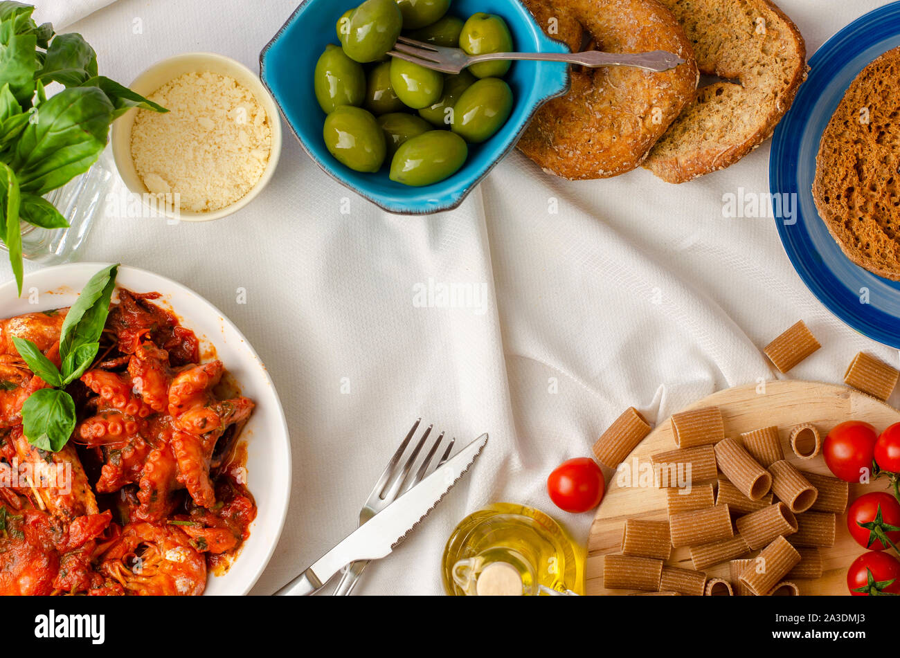 Traditional italian dish. Stewed octopus and prawns with tomatoes ...