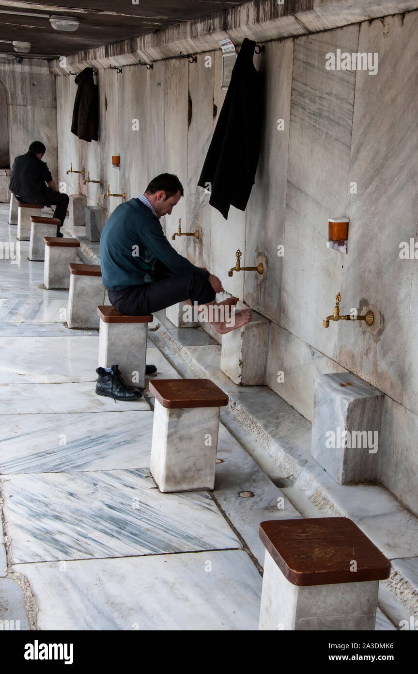 Muslim people wash their feet before entering in mosque in Istanbul ...