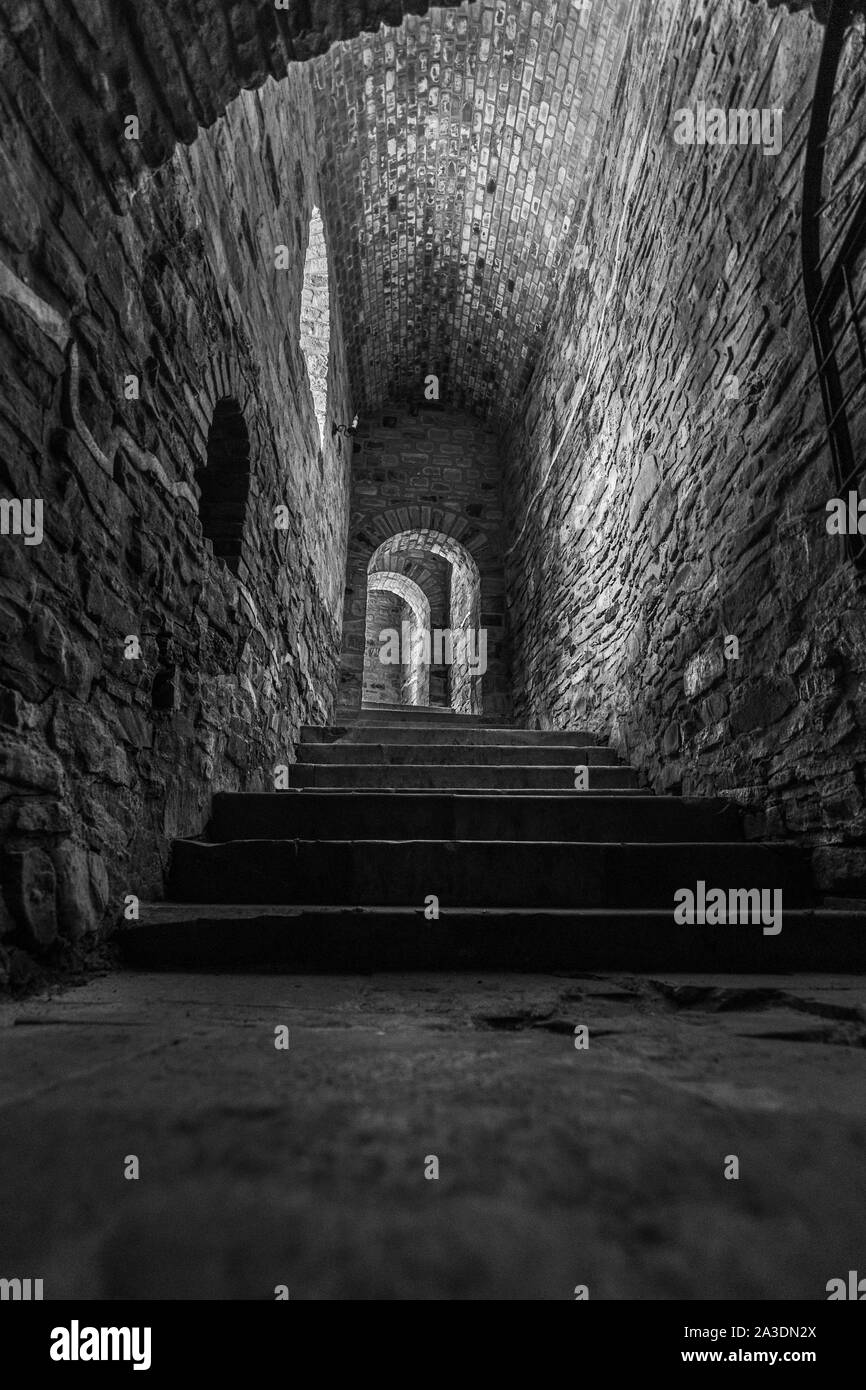 Stone corridor in old medieval castle, in Romanian old city Stock Photo ...