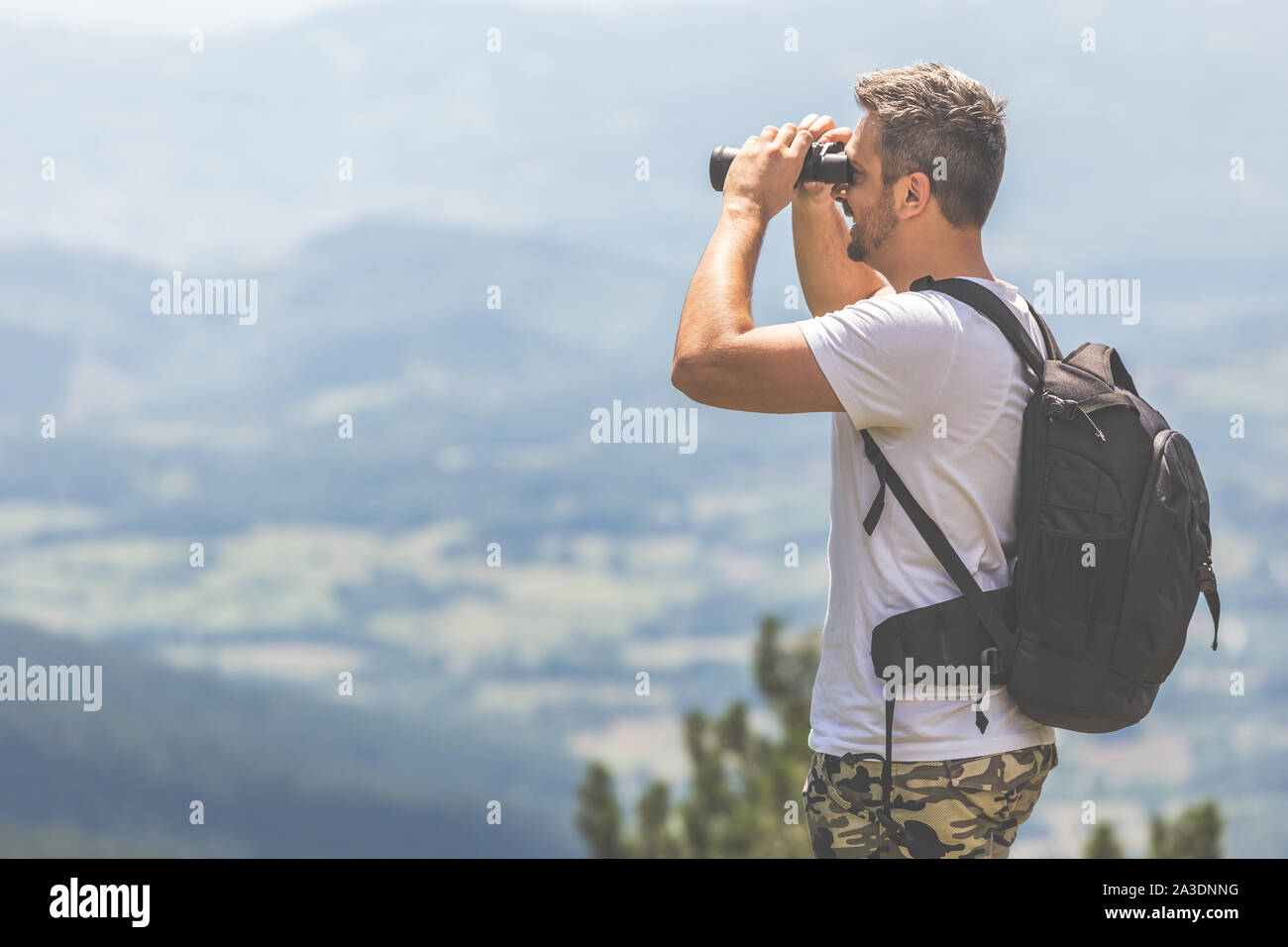 Man using binocular in mountain hi-res stock photography and images - Alamy