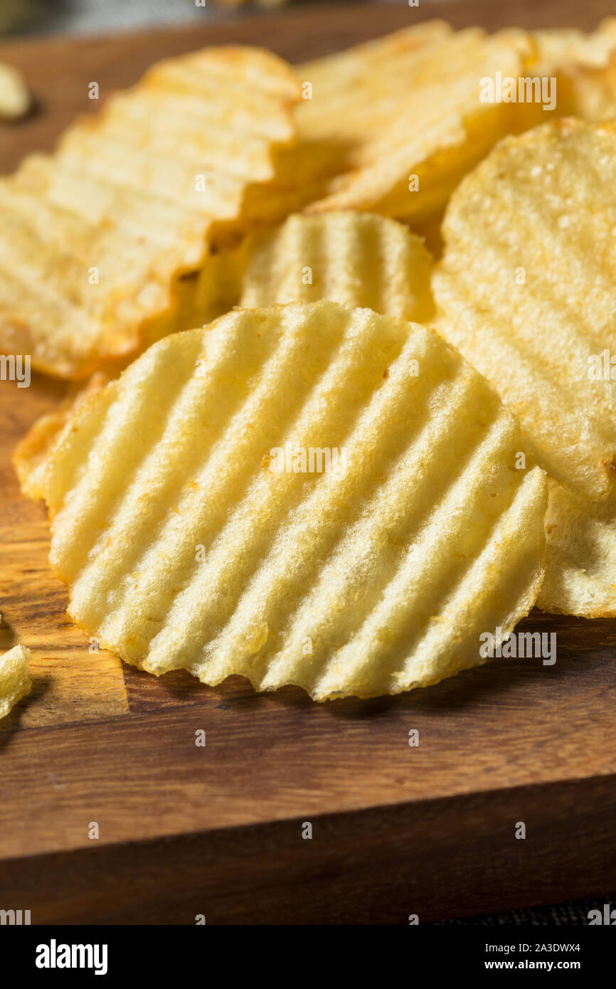 Organic Salted Wavy Potato Chips Ready to Eat Stock Photo - Alamy